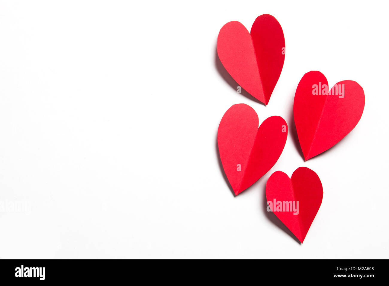 Red handmade paper hearts on a white background Stock Photo - Alamy