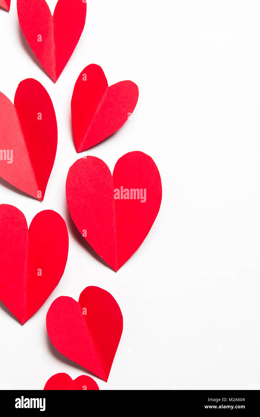 Red handmade paper hearts on a white background Stock Photo - Alamy