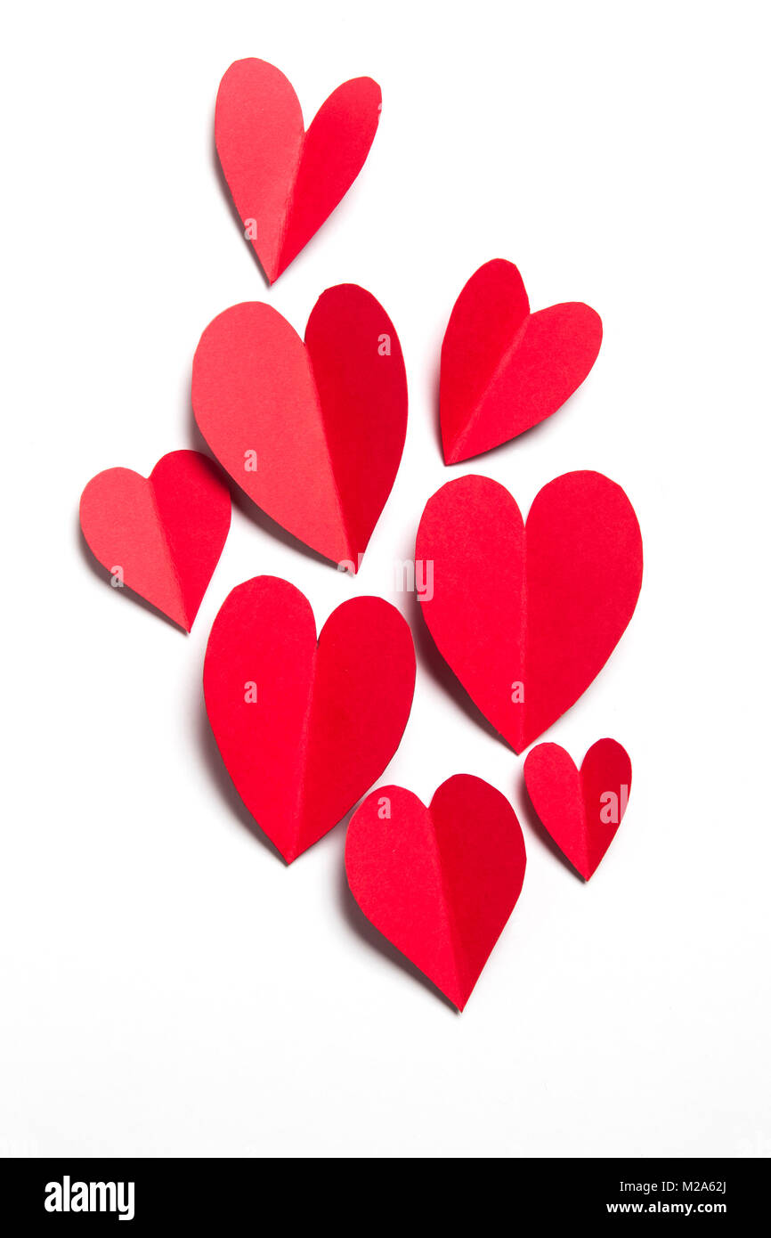 Red handmade paper hearts on a white background Stock Photo - Alamy