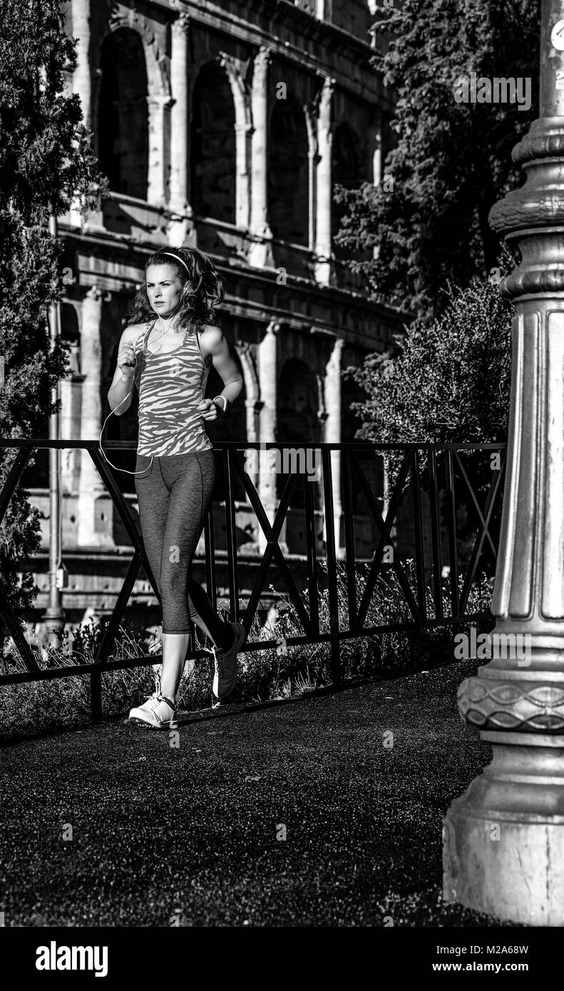 Gladiator inspiring trainings. young fitness woman in sport clothes in ...