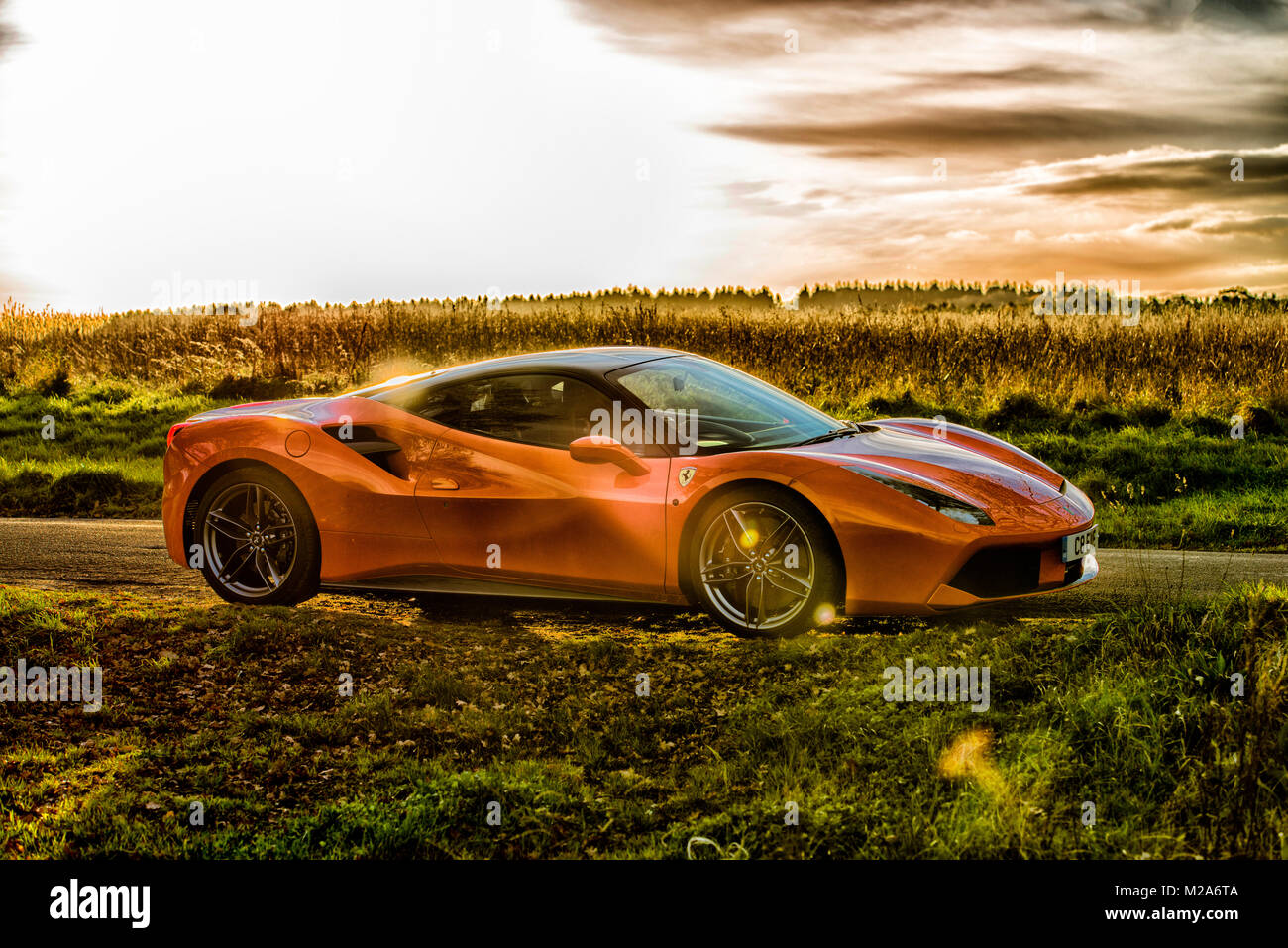 A Ferrari 488 GTB silhouetted against the sunset. 3.9 litre V8 0-62 mph ...