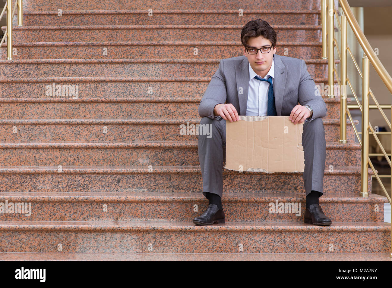 Desperate businessman begging on the street Stock Photo - Alamy