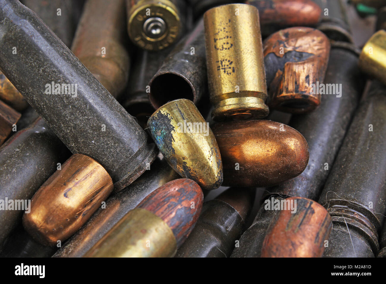 Heap of gun bullets. Weapon Cartridge case sleeve background texture, 7 ...