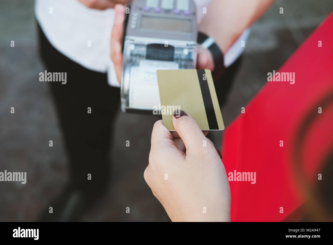 woman make payment with credit card swipe through terminal. customer ...