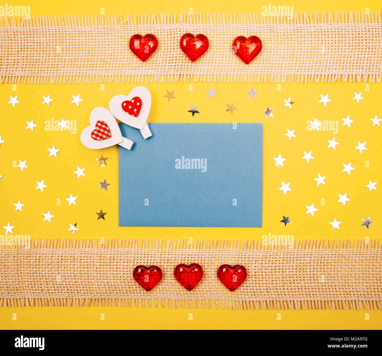 Red heart against yellow background Stock Photo - Alamy