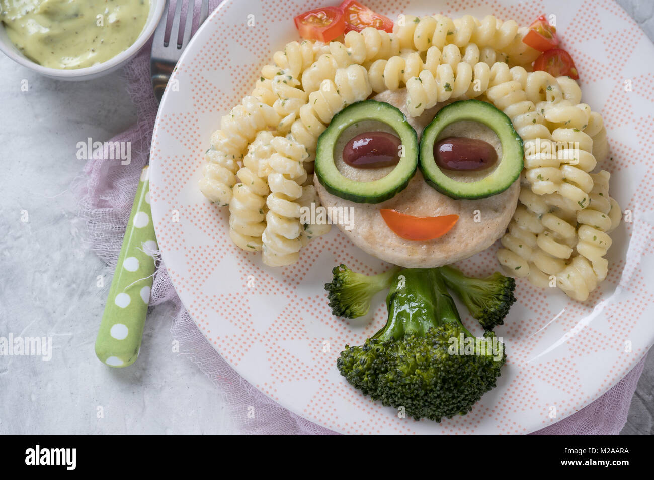 Funny Girl Food Face with chicken Cutlet, Pasta and Vegetables Stock ...