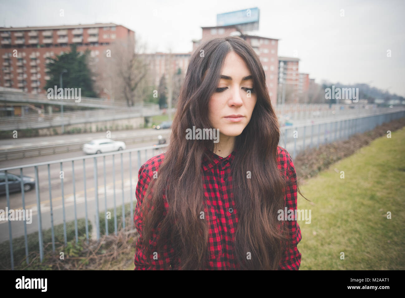 portrait young beautiful woman posing outdoor looking down hopeful ...