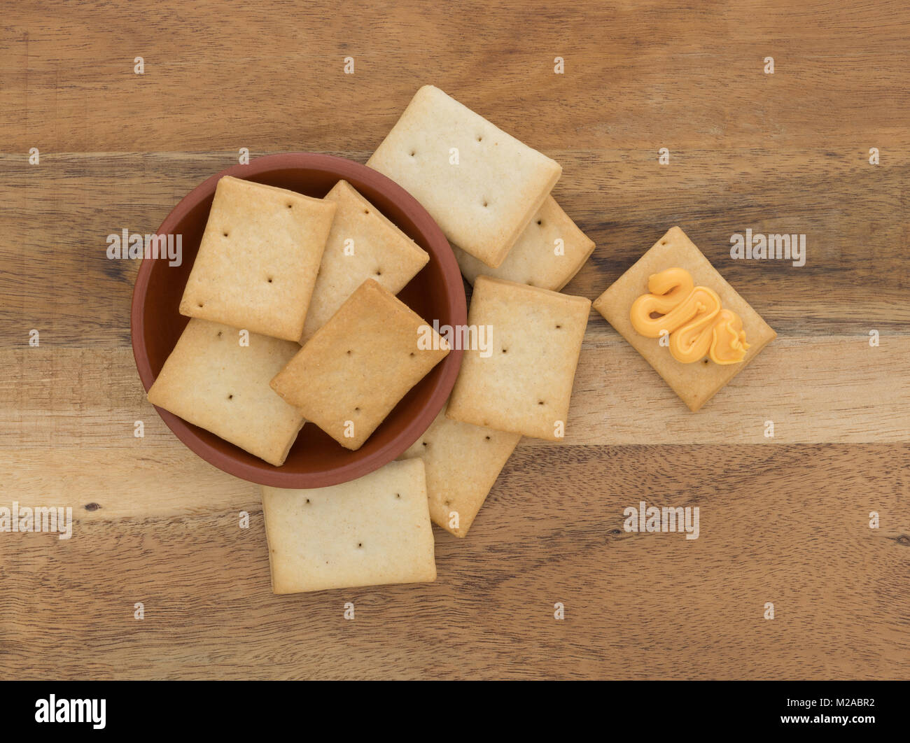 Top view of a serving of hard bread crackers in a red clay bowl with ...