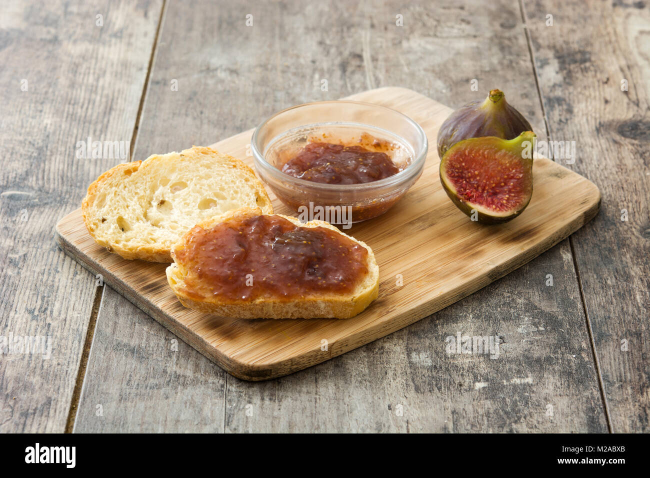 Sweet fig jam in jar on wooden table Stock Photo - Alamy