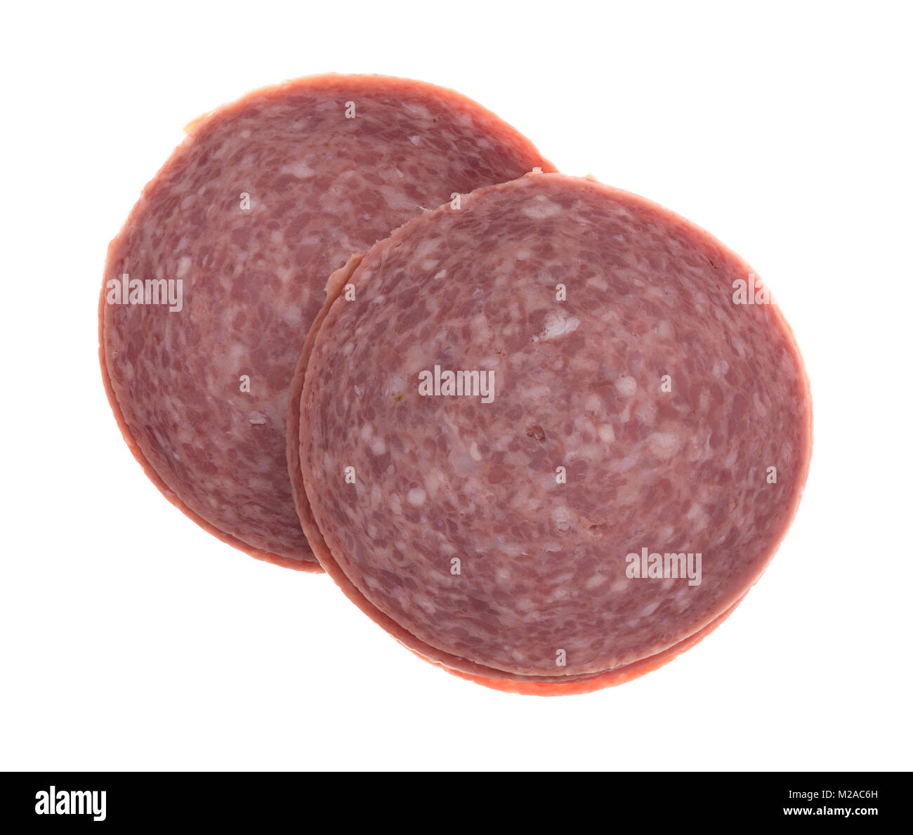 Top view of two small stacks of Genoa salami isolated on a white ...