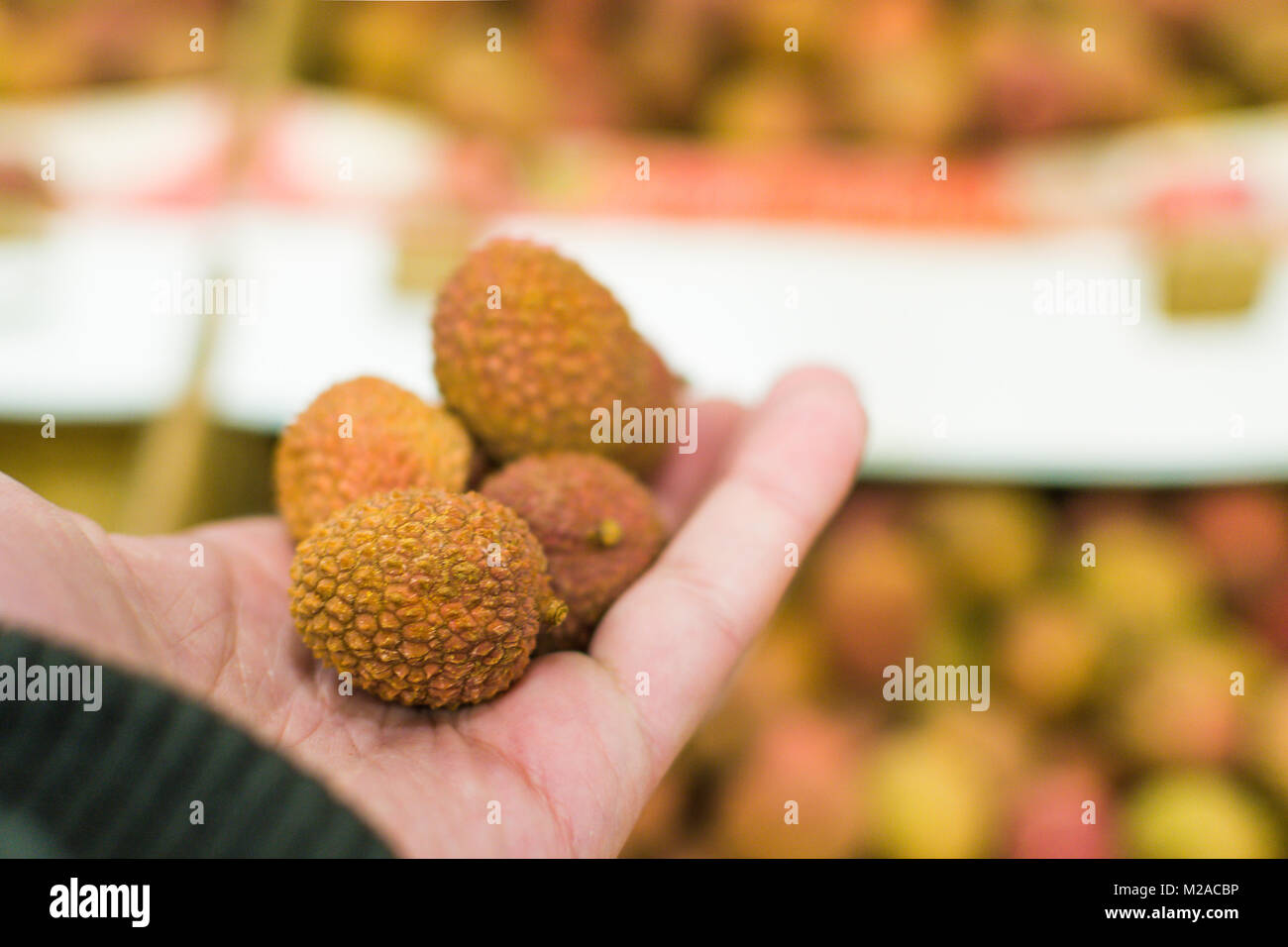 lychee on the market lychee choice for cooking Stock Photo - Alamy