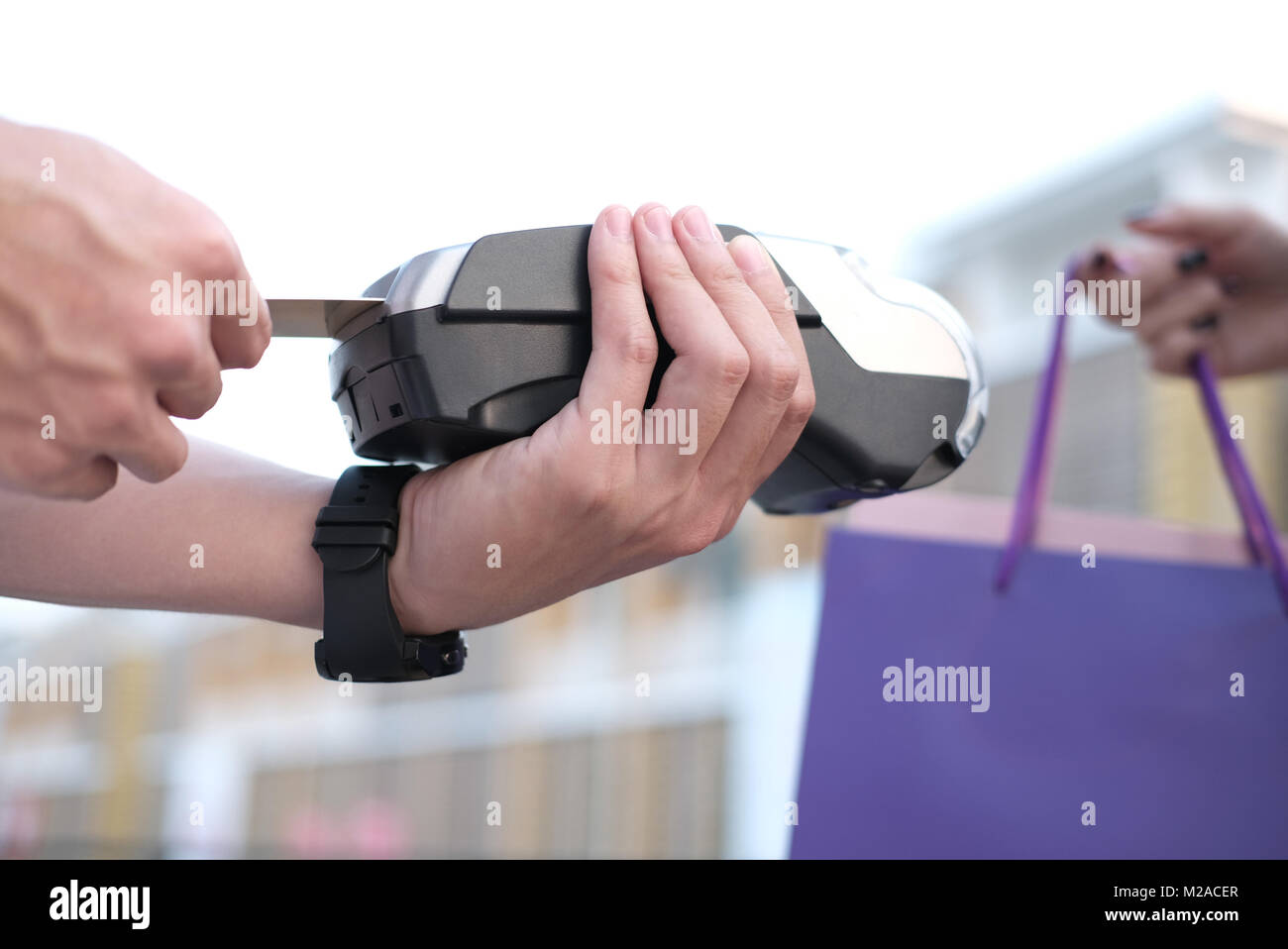 woman make payment with credit card swipe through terminal. customer ...