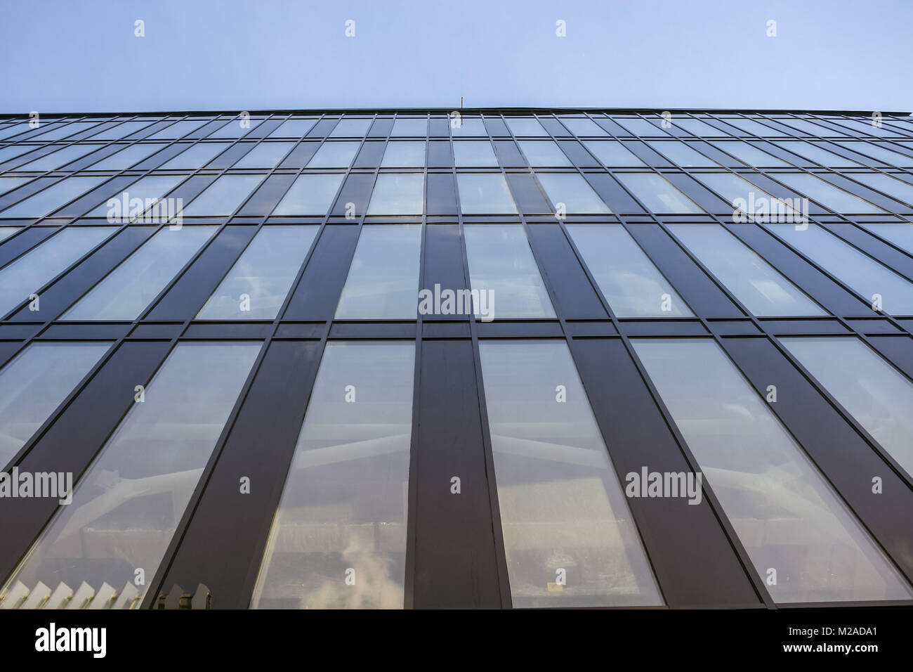 Close-up modern office building with mirror windows. Perspective view ...