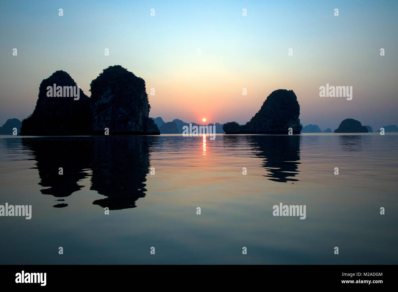 Sunset at Bai Tu Long Bay Stock Photo - Alamy