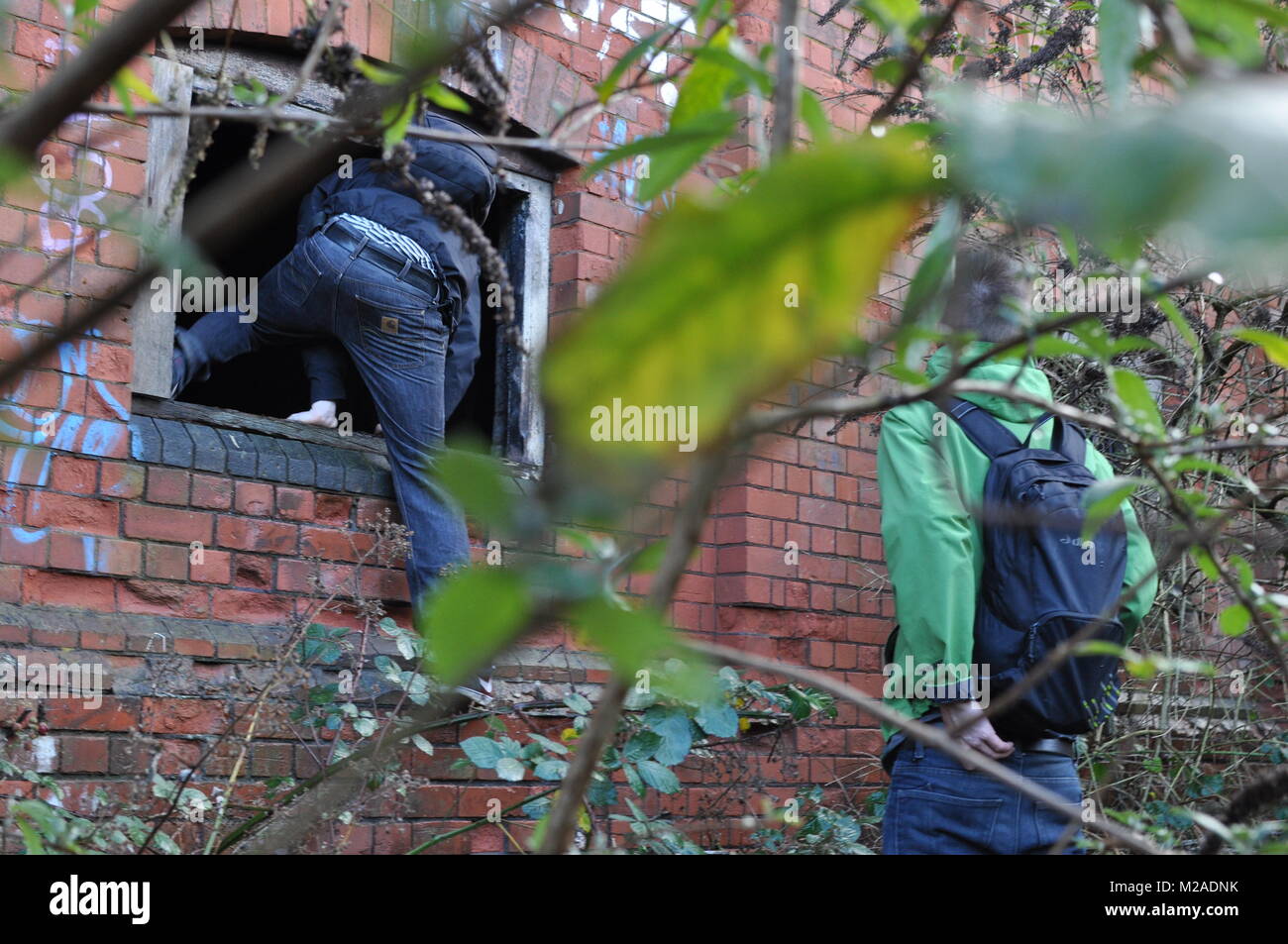 Brick through window hi-res stock photography and images - Alamy