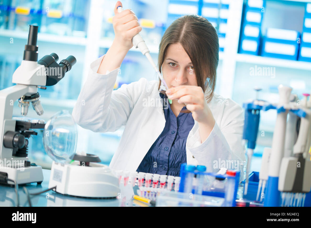young woman lab assistant in a genetics lab Stock Photo - Alamy