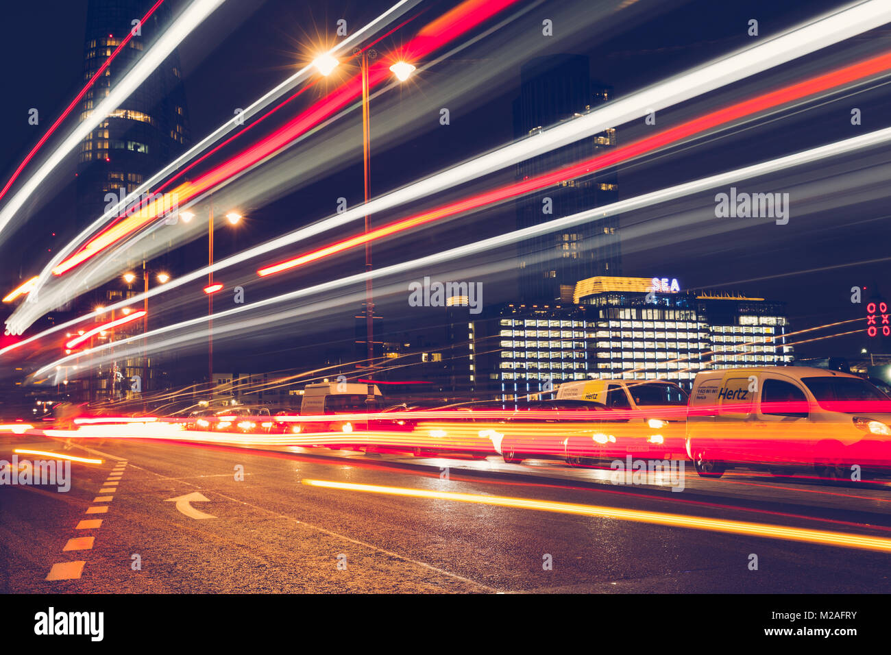 LONDON - FEBRUARY 01, 2018: City light trails of car and red bus ...