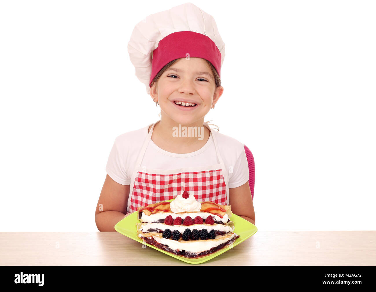 happy little girl cook with crepes Stock Photo - Alamy