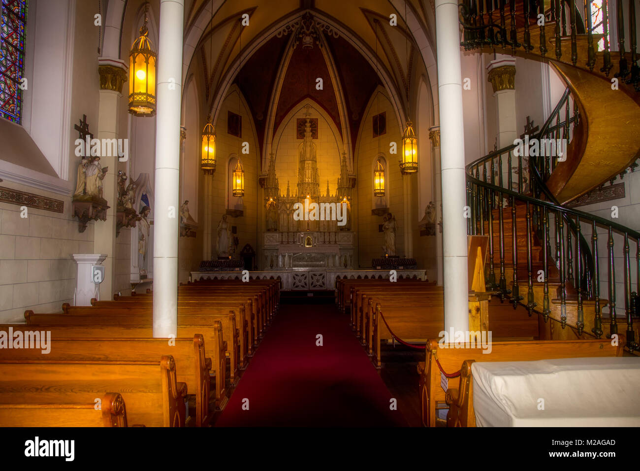The interior of the Loretto Chapel church with a curving staircase in ...