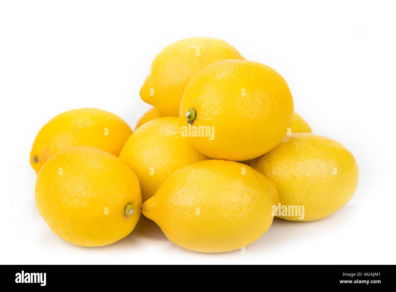 Fresh juicy lemons with halves on the white background Stock Photo - Alamy