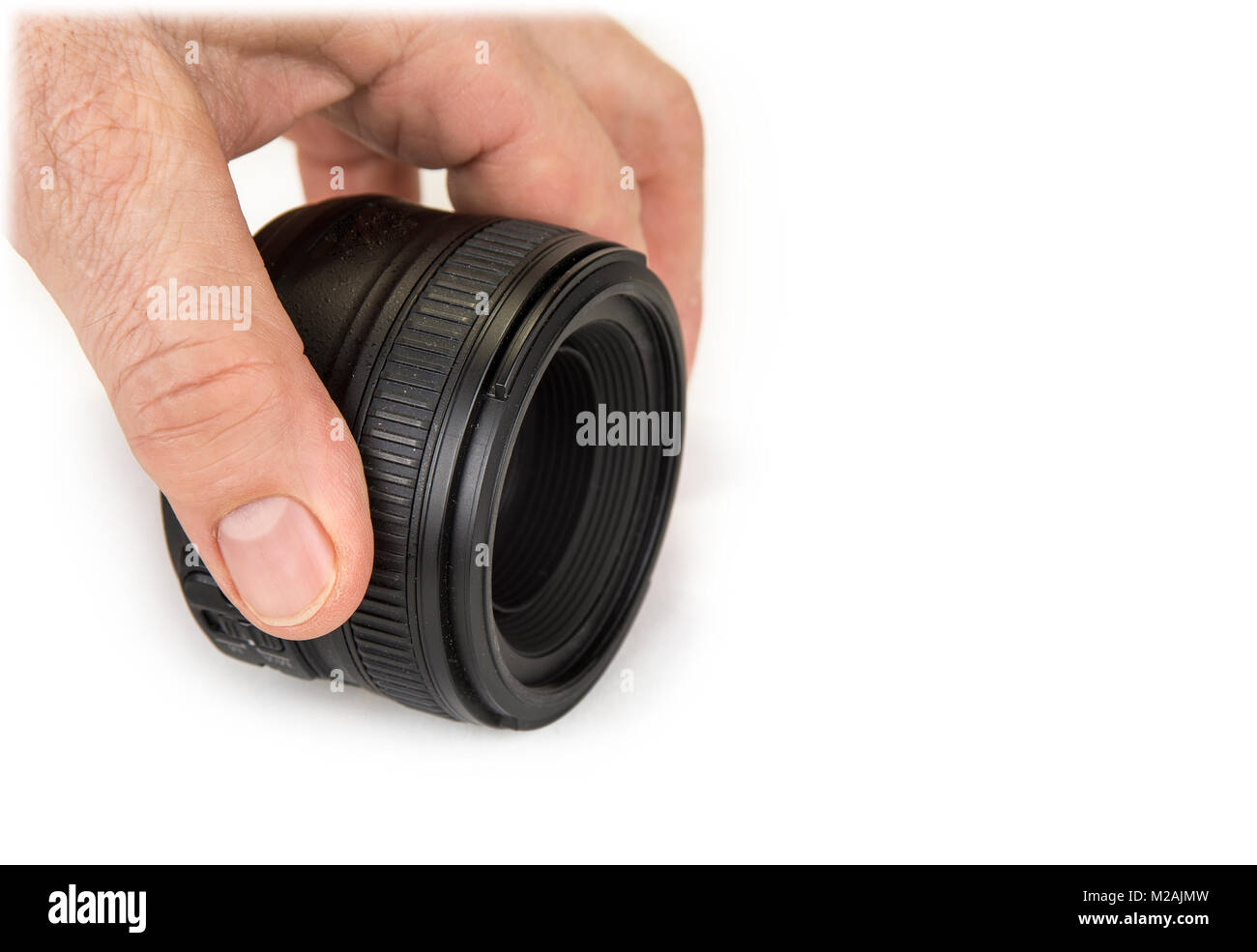 Zoom and fix lenses on camera on the white background Stock Photo - Alamy