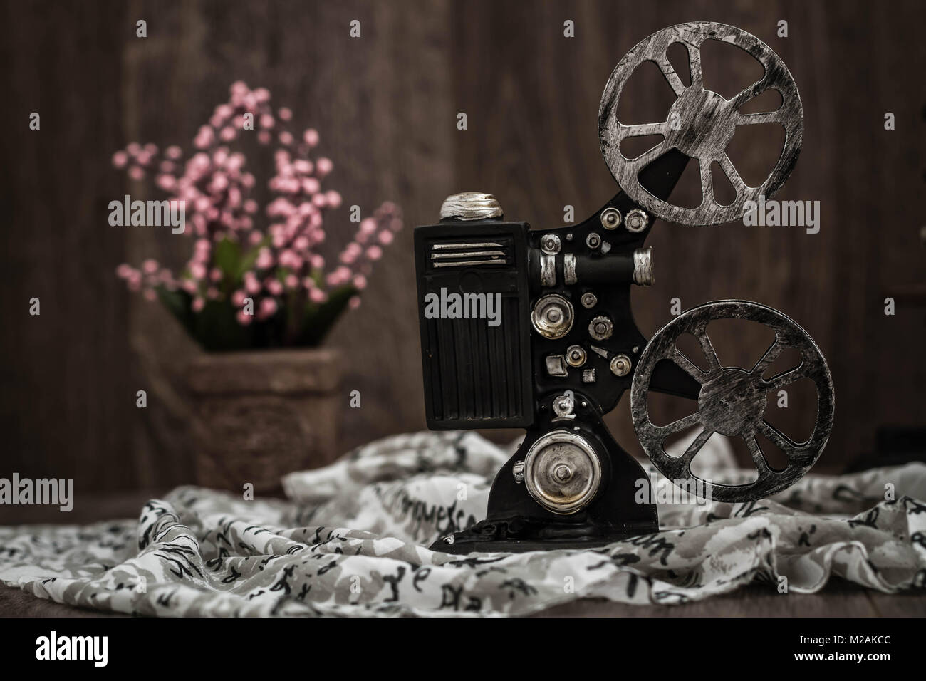 Small nostalgic decorative film camera on brown wooden background Stock ...