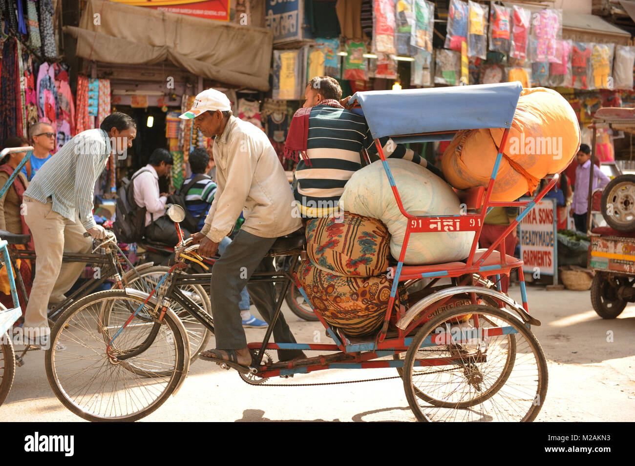 A loaded rickshaw travels through Paharganj, India Stock Photo - Alamy