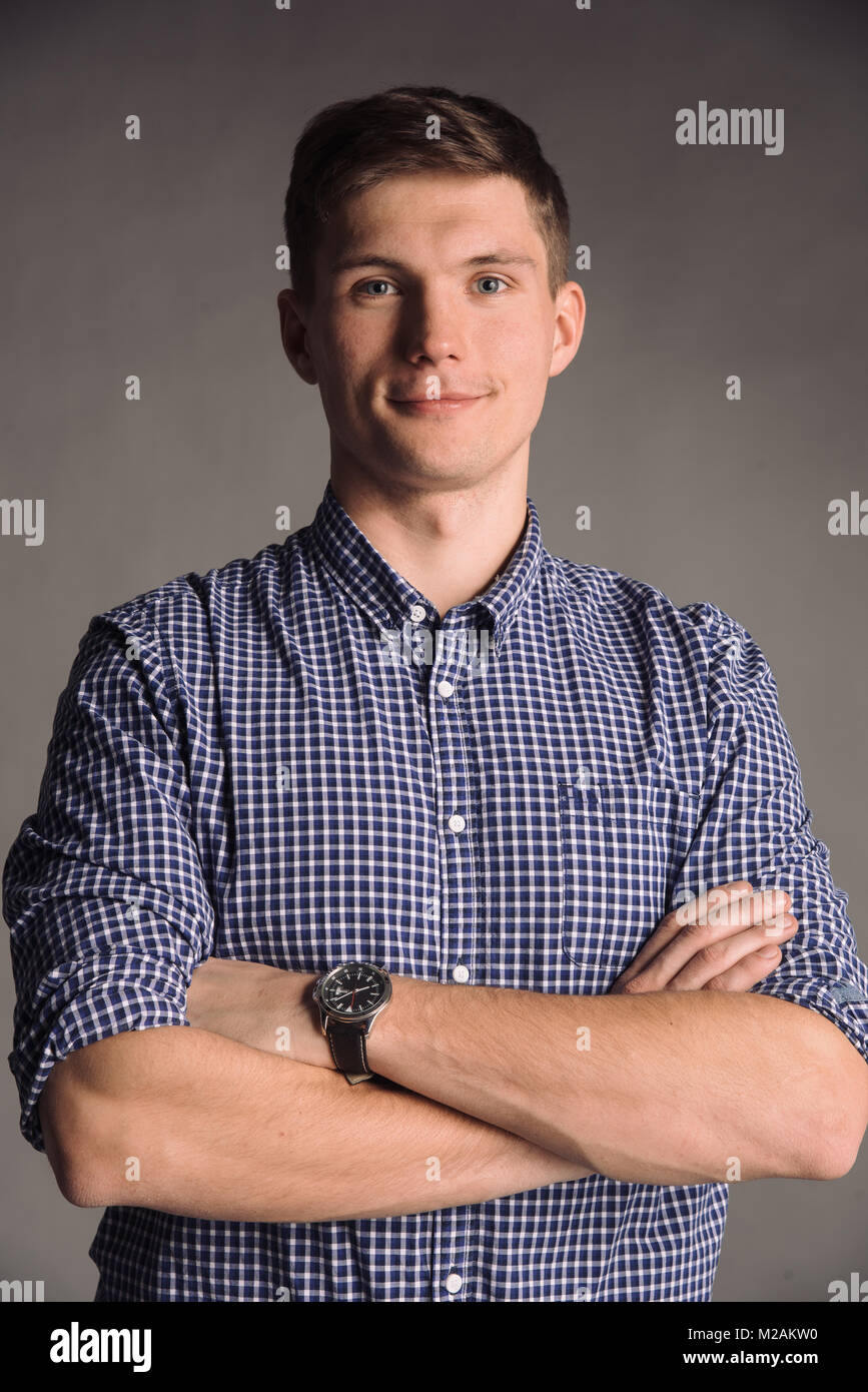 Colored portrait of smiling man isolated on gray studio background ...