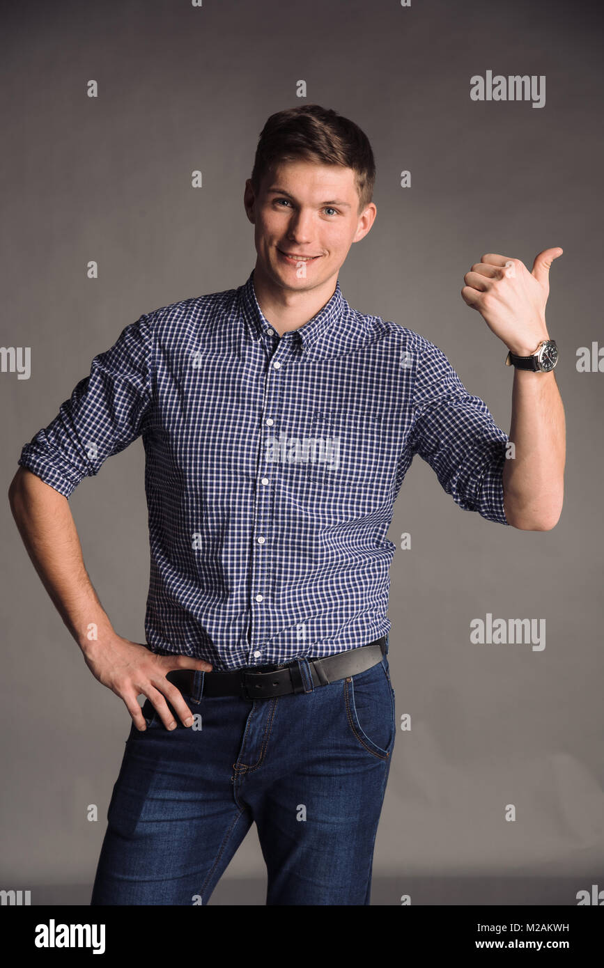 Colored portrait of smiling man isolated on gray studio background ...
