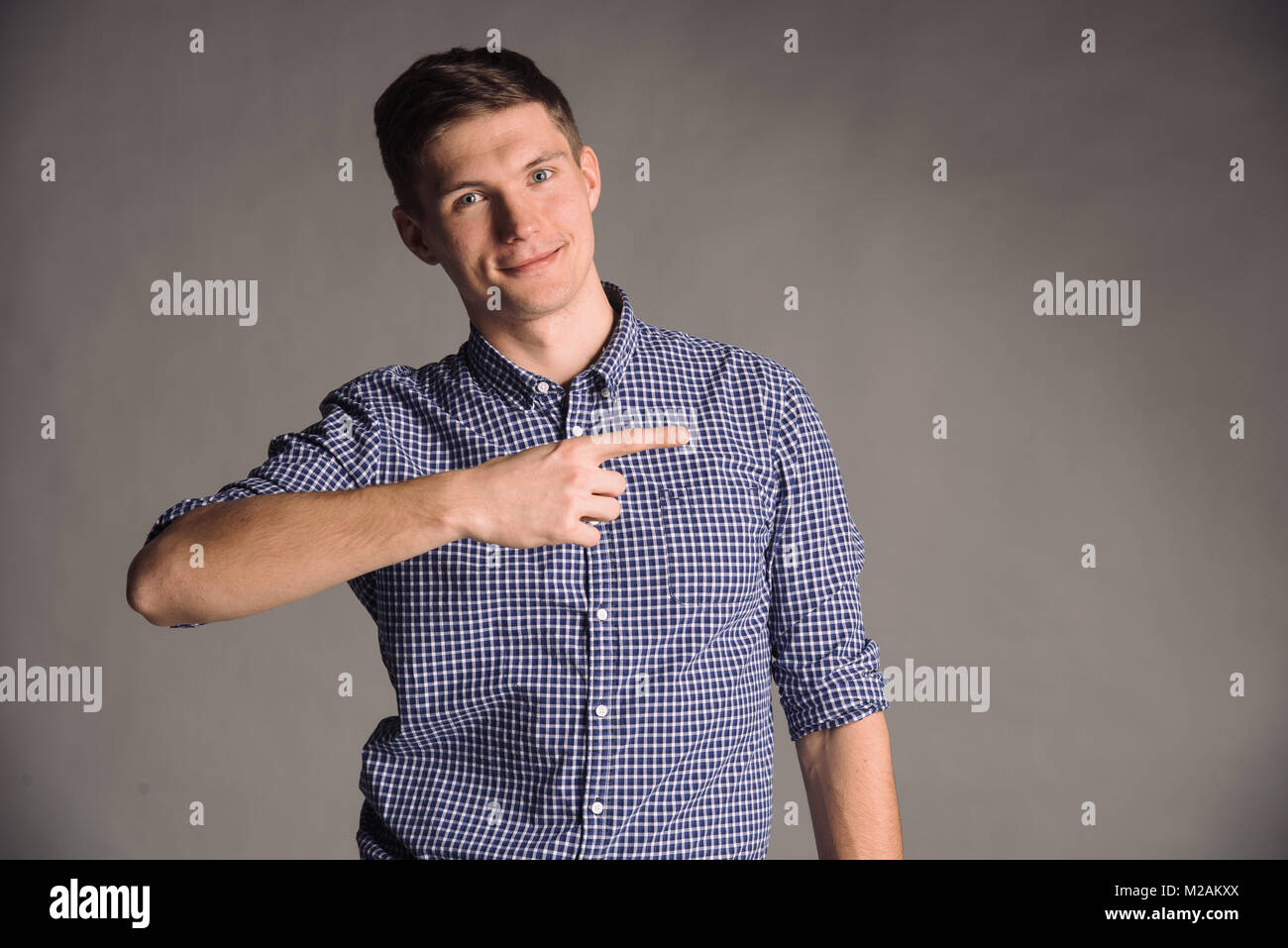 Colored portrait of smiling man isolated on gray studio background ...
