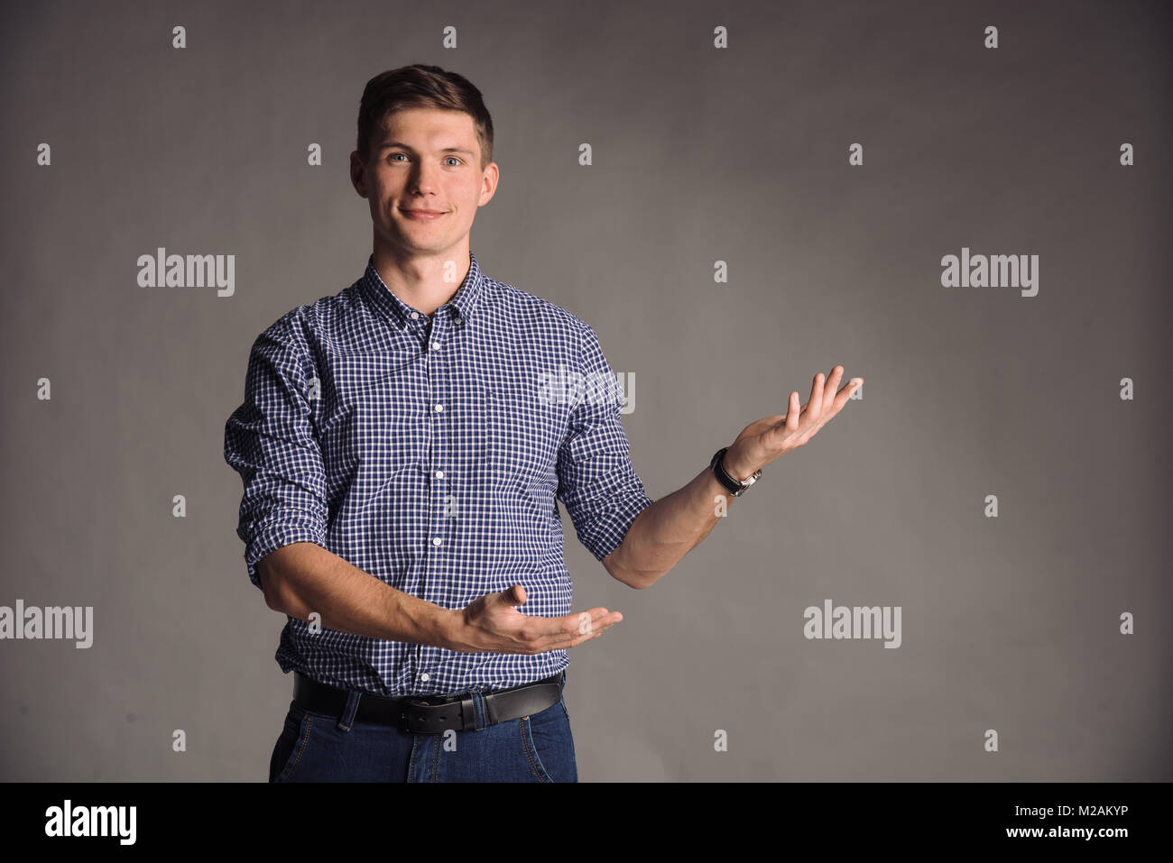Colored portrait of smiling man isolated on gray studio background ...