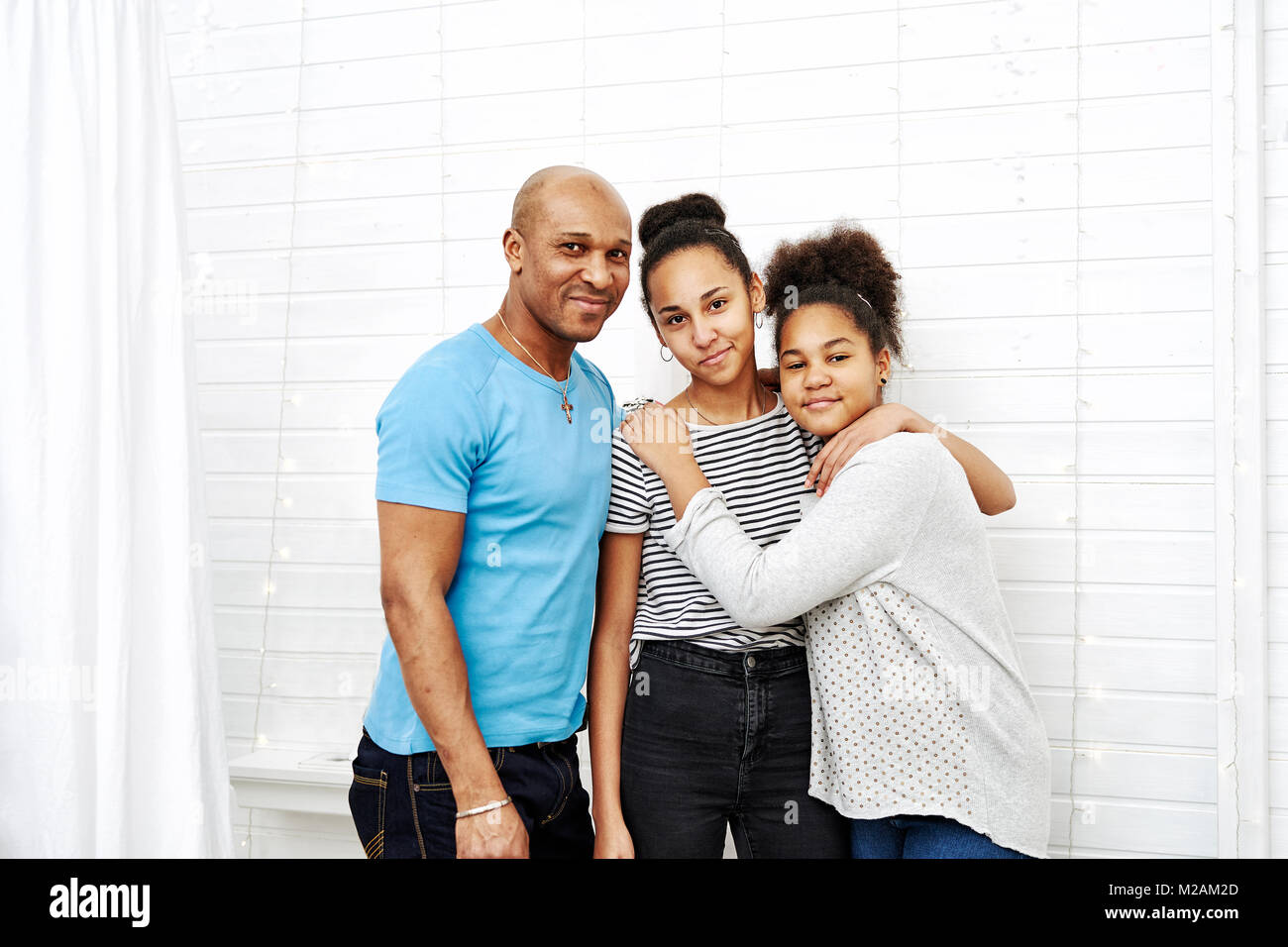 Father and two daughters Stock Photo - Alamy