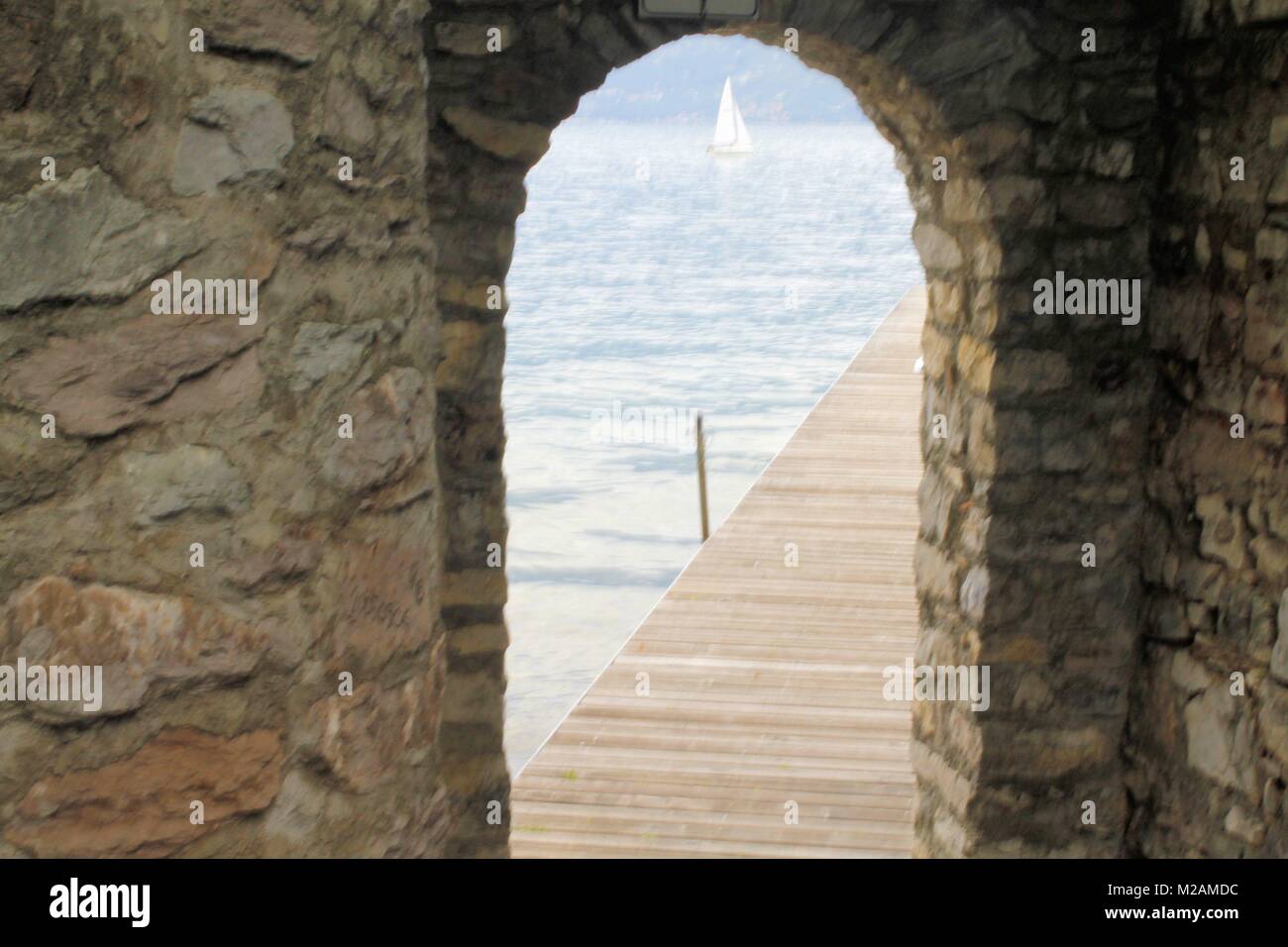 ancient stone gate on the Garda lake in Italy Stock Photo - Alamy