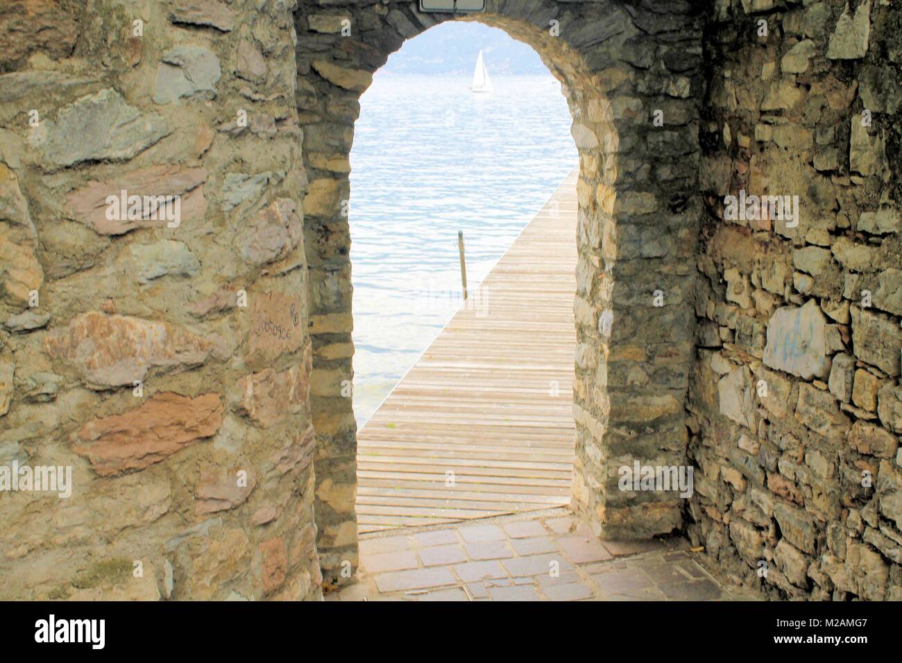 ancient stone gate on the Garda lake in Italy Stock Photo - Alamy