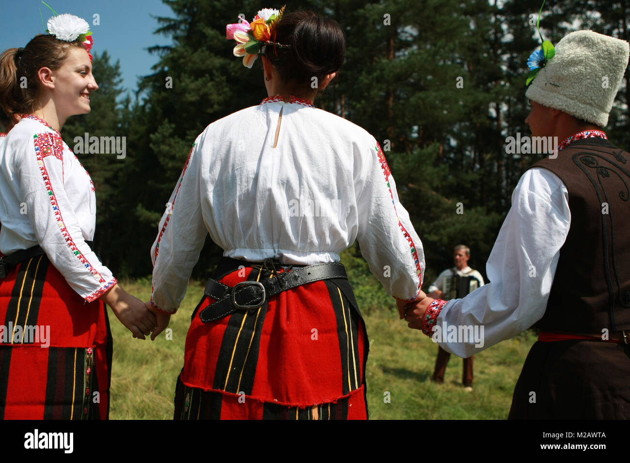 People in traditional folk costume of The National Folklore Fair in ...
