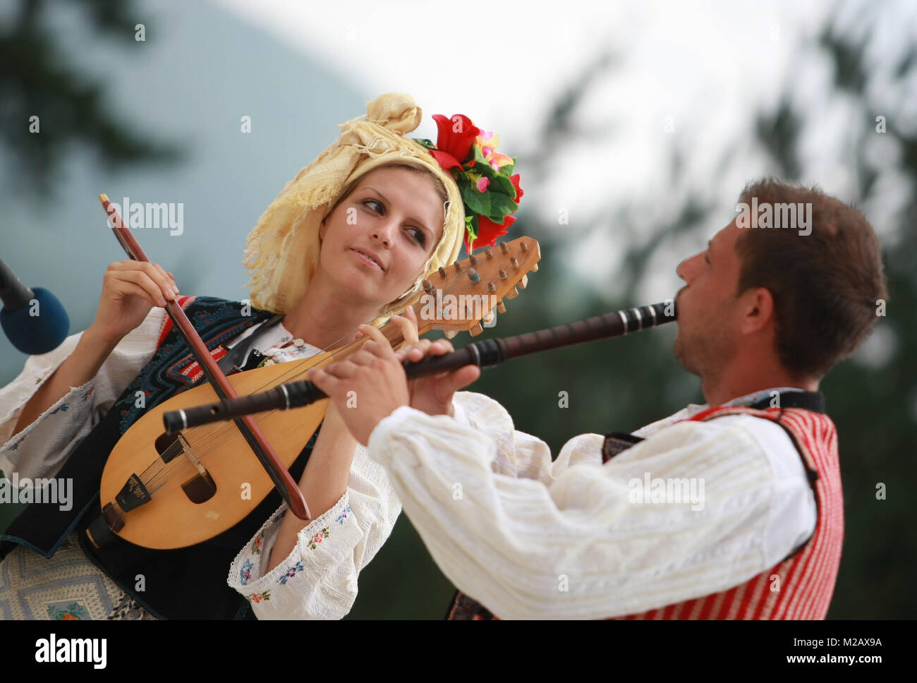 People in traditional folk costume of The National Folklore Fair in ...