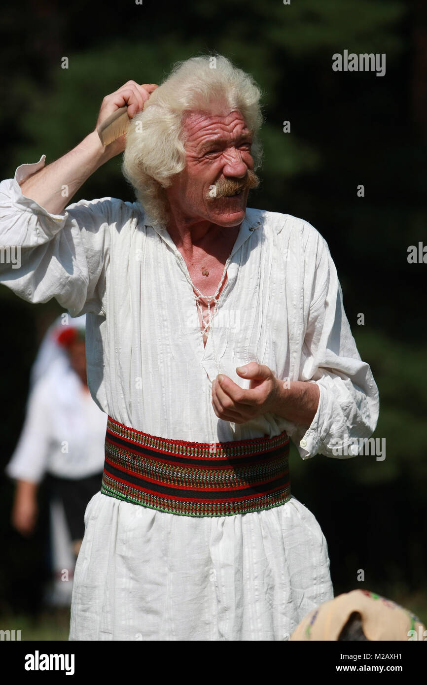 People in traditional folk costume of The National Folklore Fair in ...