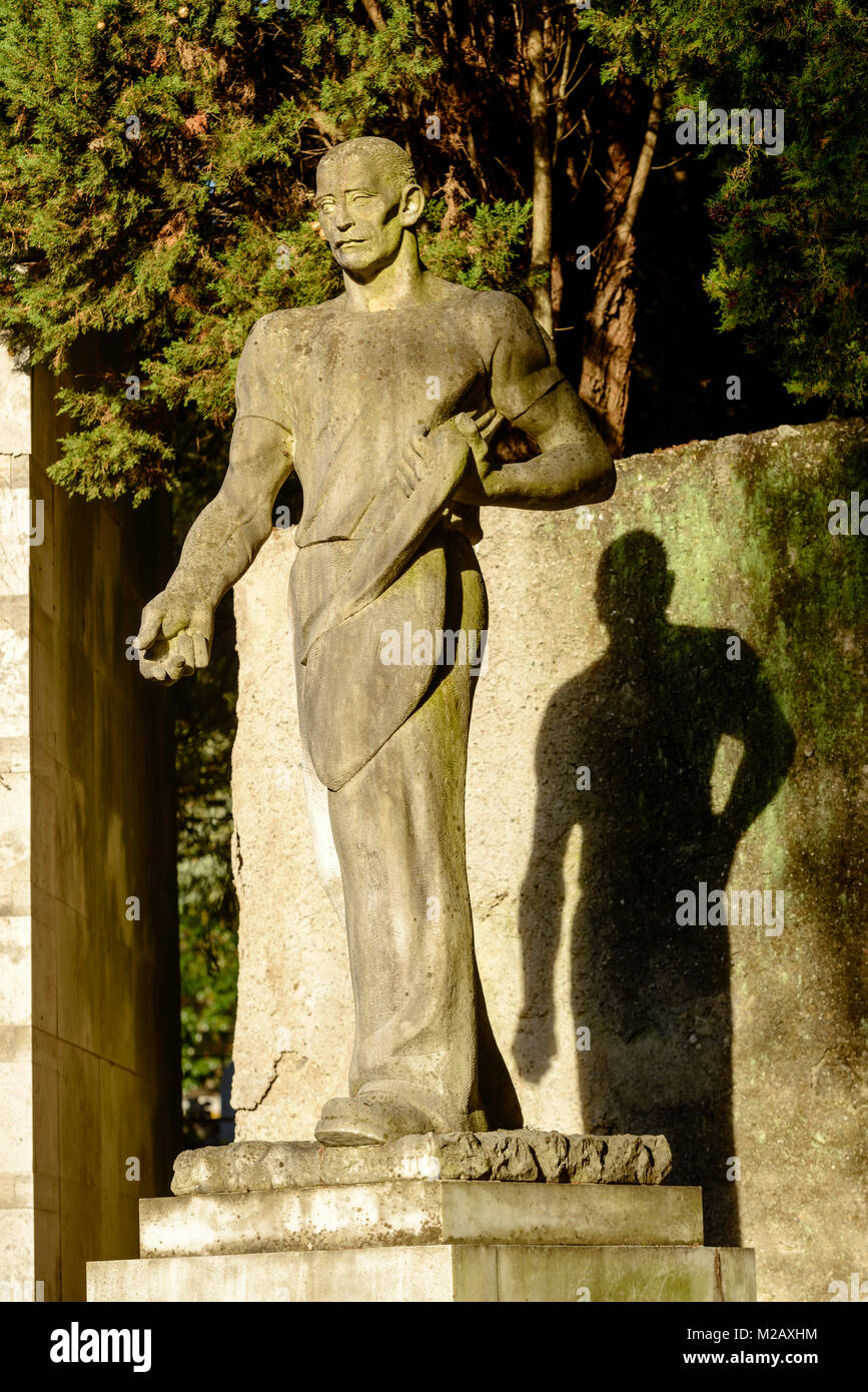 stone sculpture of man at historical monumental Staglieno Cemetery in ...