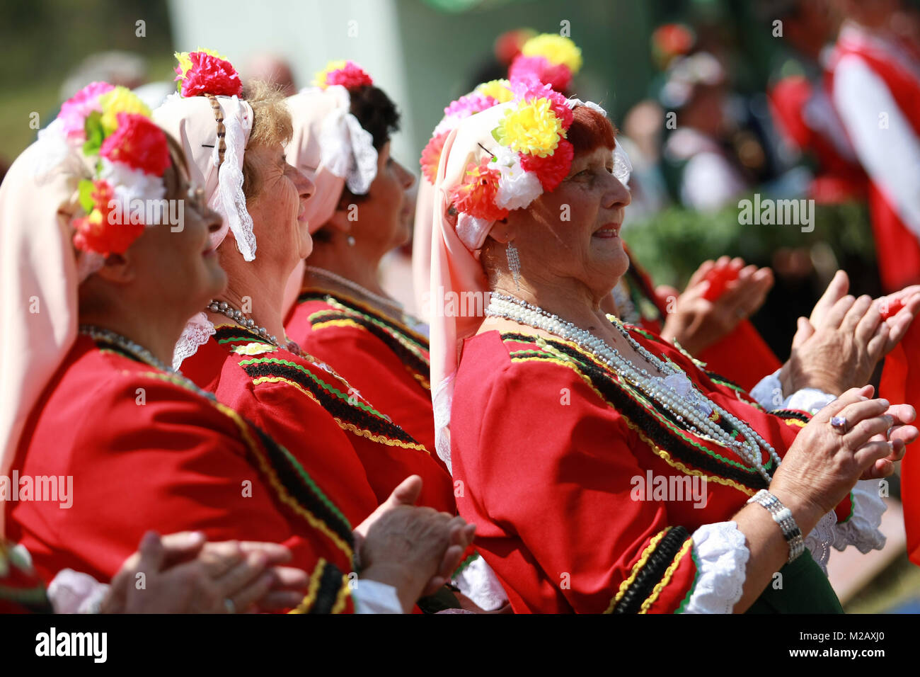 People in traditional folk costume of The National Folklore Fair in ...