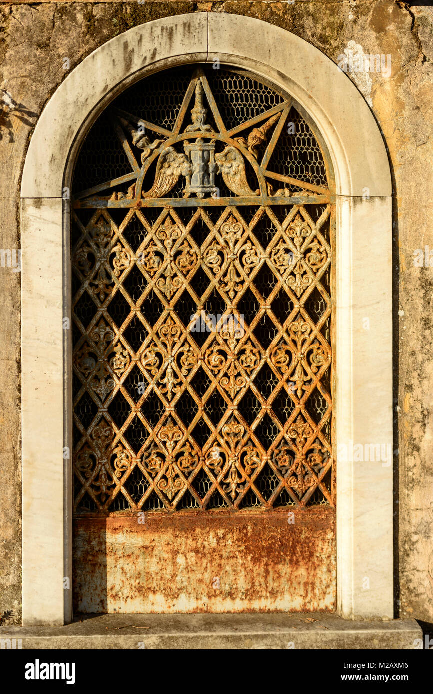 decorated wrought iron grating at historical monumental Staglieno ...