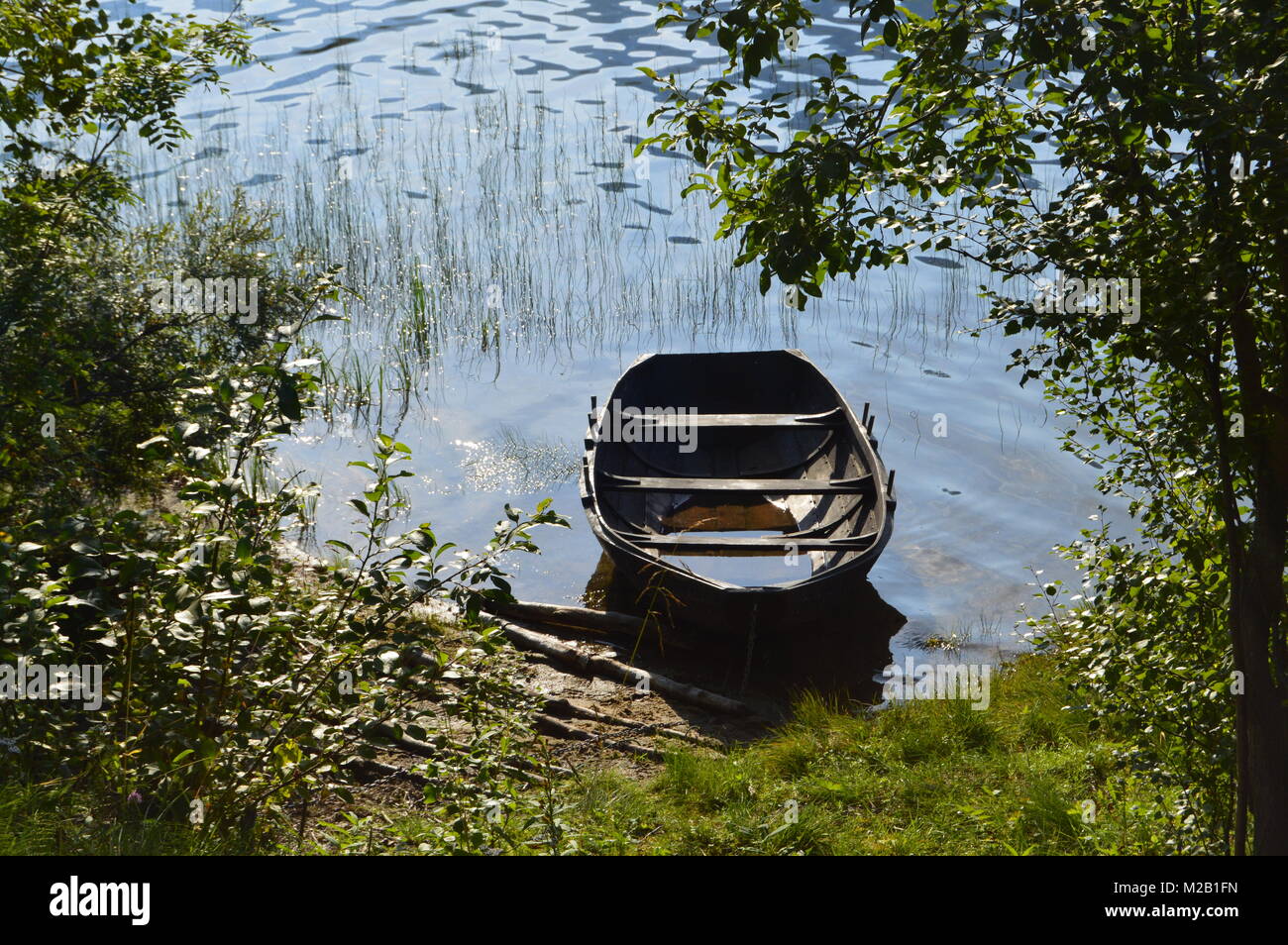 Rowing boat at Lakeside, Sweden Stock Photo - Alamy