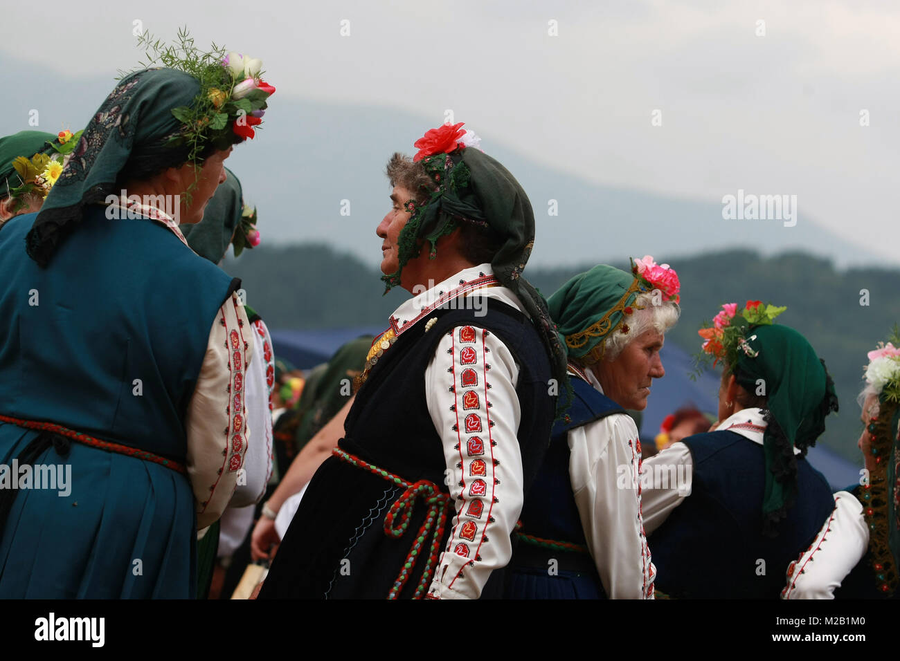 People in traditional folk costume of The National Folklore Fair in ...