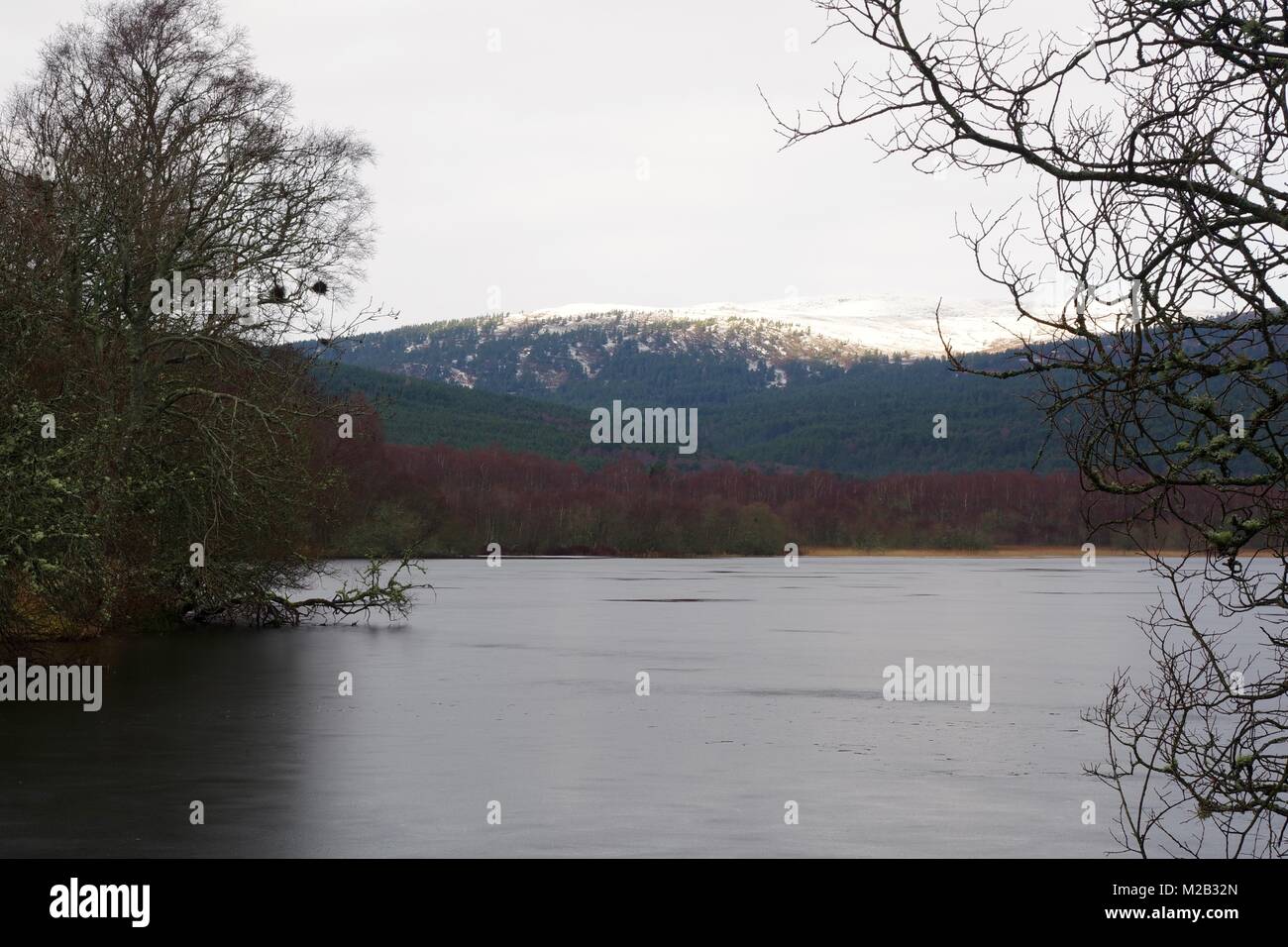Snow Capped Hills beyond the Frozen Surface of Loch Kinord, Muir of ...