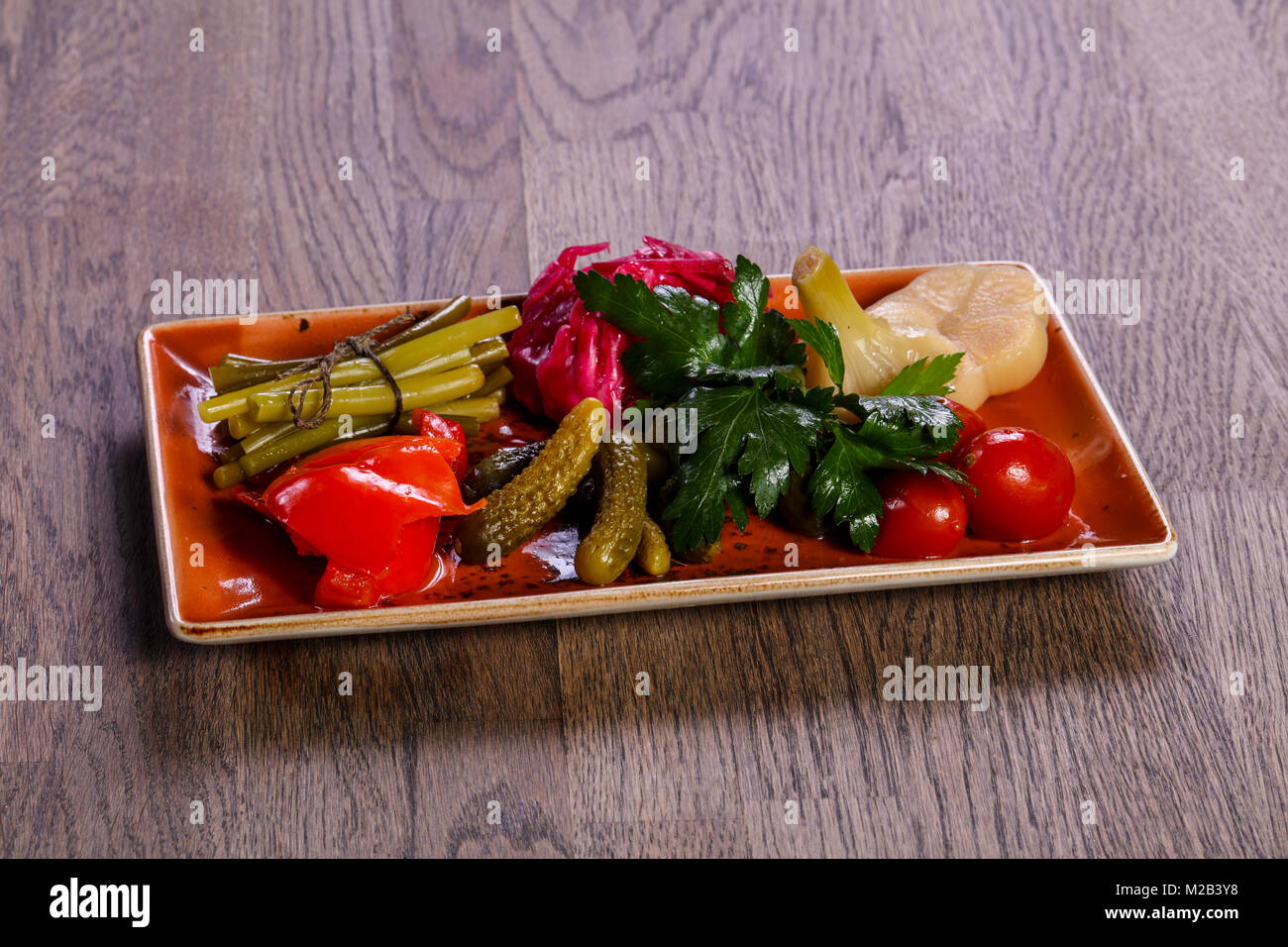 Pickled vegetables plate mix with parsley Stock Photo - Alamy
