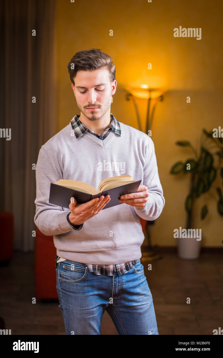 Portrait young man reading hi-res stock photography and images - Alamy