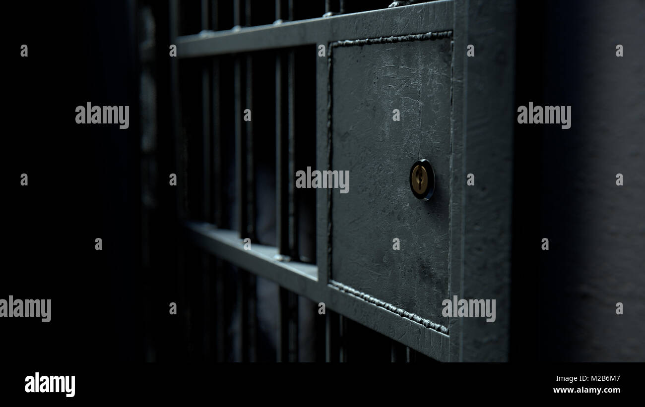 A closeup of the locking mechanism of a closed jail cell with welded ...