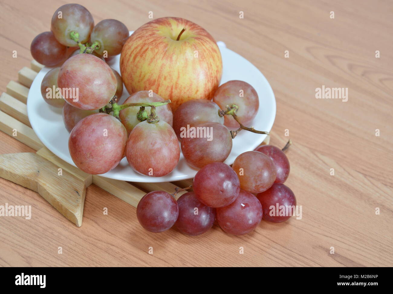 apple and red grape Stock Photo - Alamy