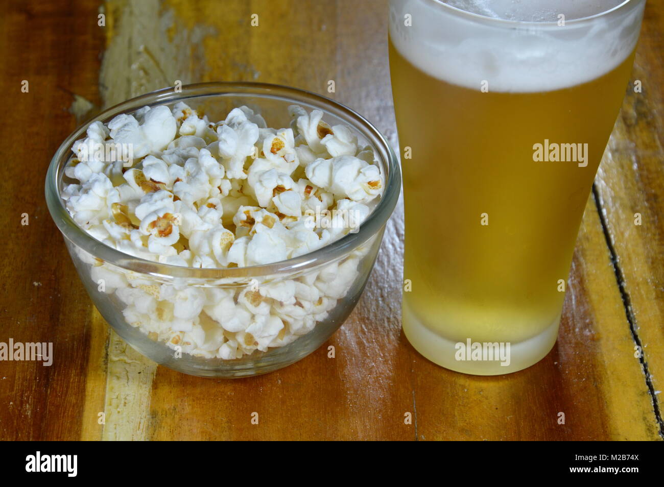 popcorn and beer on table Stock Photo - Alamy