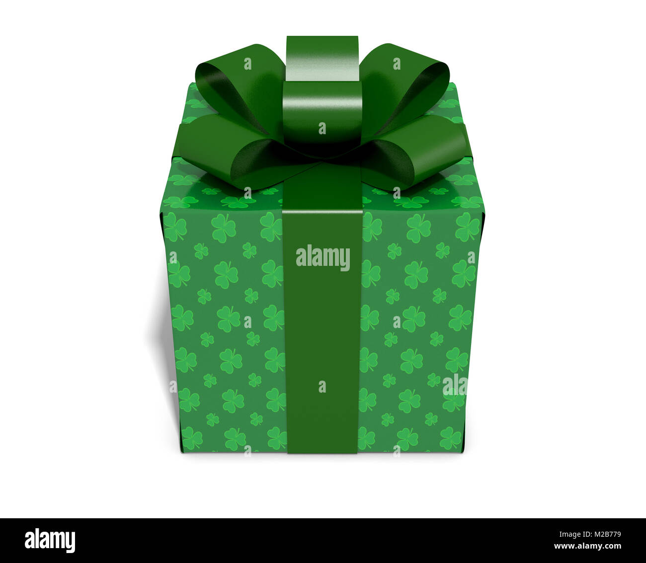 A cube shaped gift wrapped in clover patterned wrapping paper and bound ...