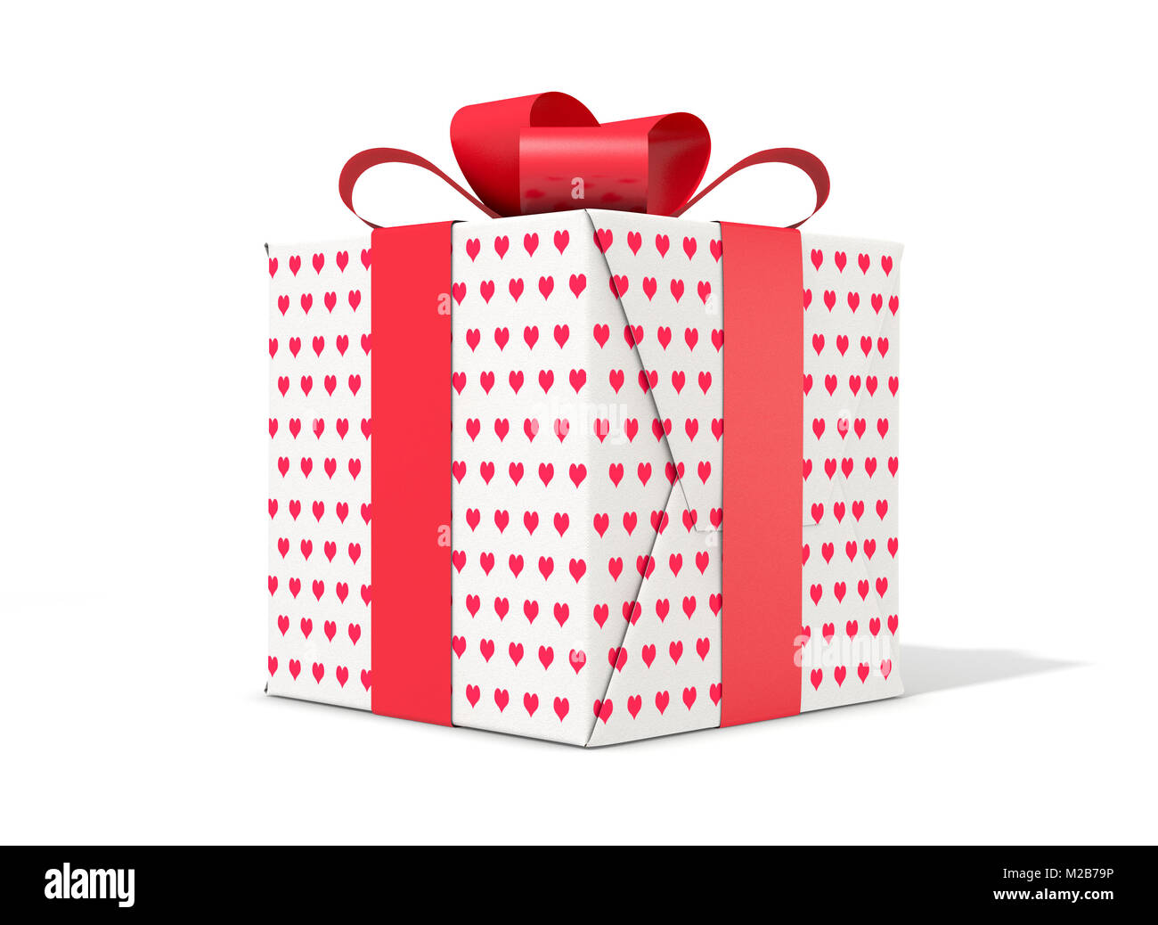 A cube shaped gift wrapped in heart patterned wrapping paper and bound ...
